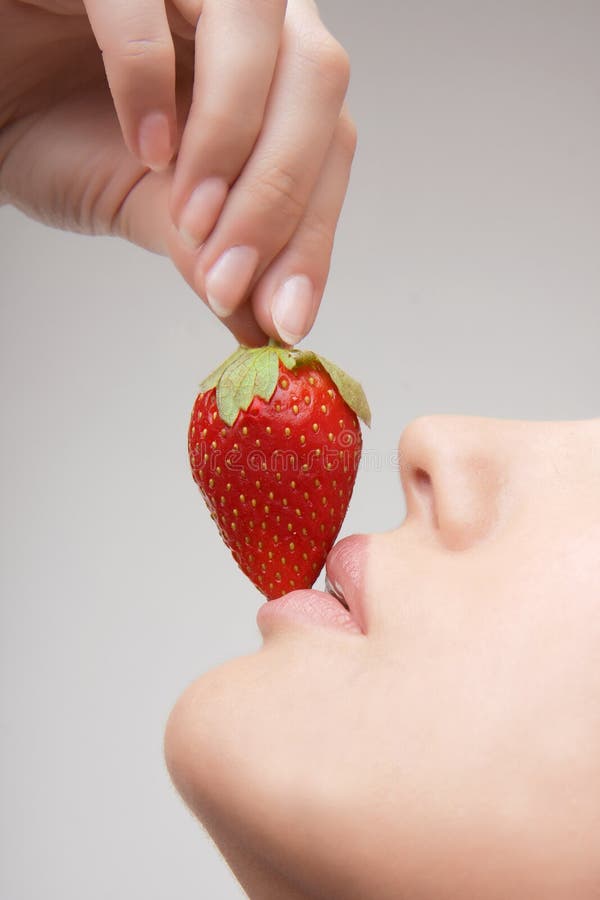 Woman Eating Strawberry stock image. Image of berry, beauty - 31454011