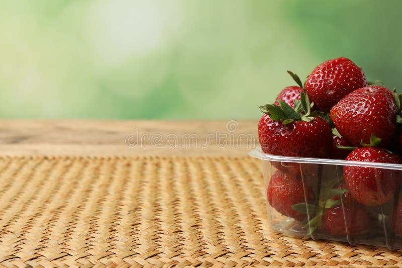 Strawberries on a Wooden Table in a Container Stock Image - Image of ...