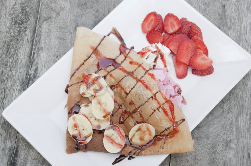 Strawberry banana crape. stock image. Image of eating - 35984399
