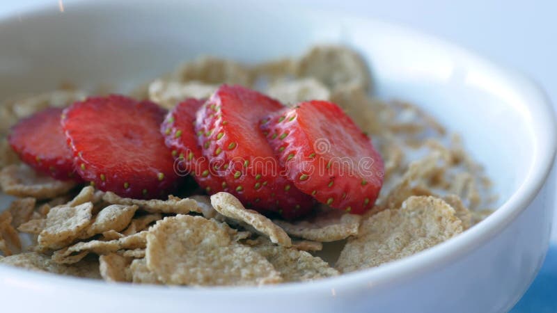 Strawberry and Corn Flakes in a Bowl on Table Stock Video - Video of ...