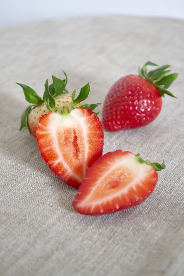 A Strawberry Cut in Half with a Green Tail. Bright Strawberries on a ...