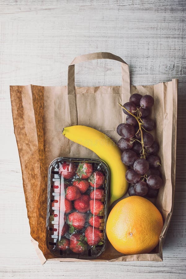 Strawberry with Different Fruit Inside a Paper Bag Vertical Stock Photo ...
