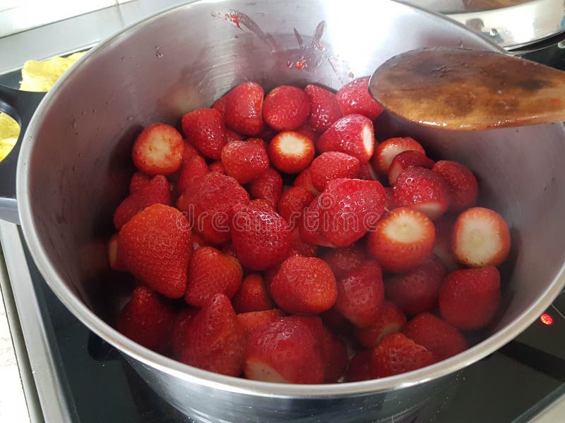 Strawberry jam preparation stock image. Image of lemon - 213650583