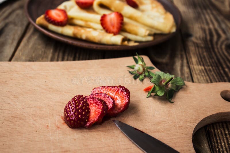 Strawberry and Knife with Crepes on Background Stock Photo - Image of ...