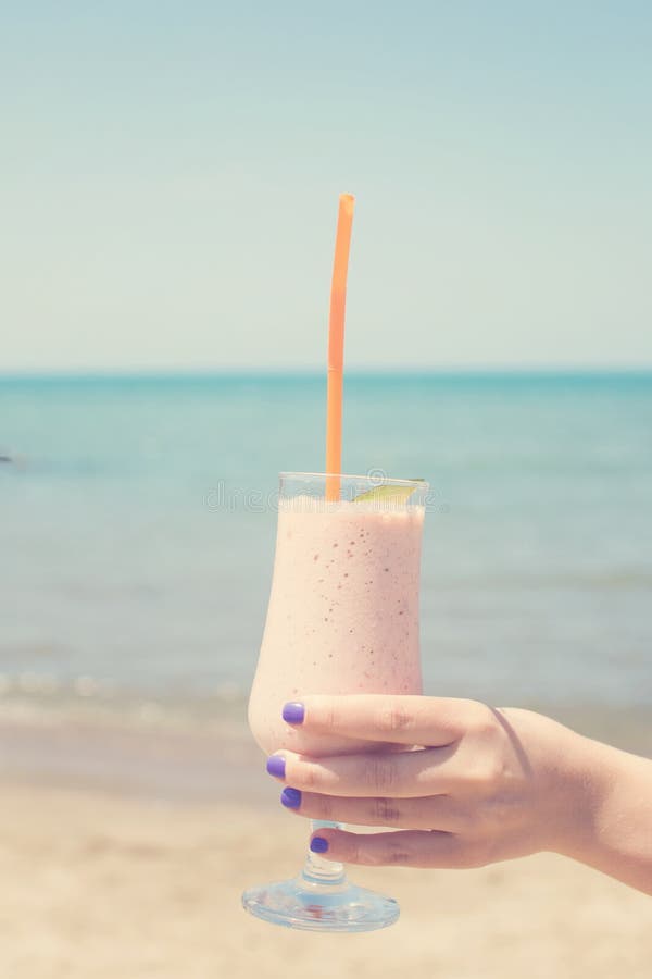 Strawberry Milkshake on the Beach Decorated with Lime Stock Image ...