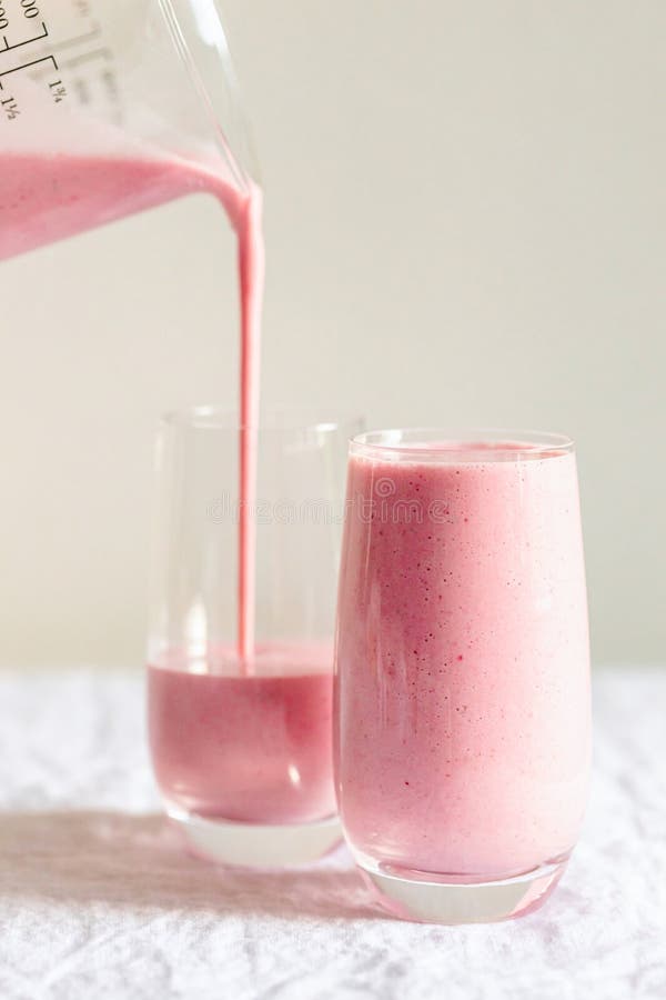 Strawberry Milkshake Pouring in Glass. Stock Photo - Image of blender ...