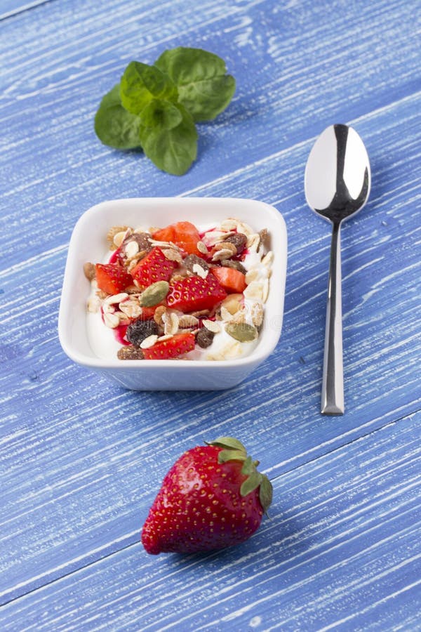 Strawberry Muesli on Blue Wooden Background Stock Photo - Image of ...