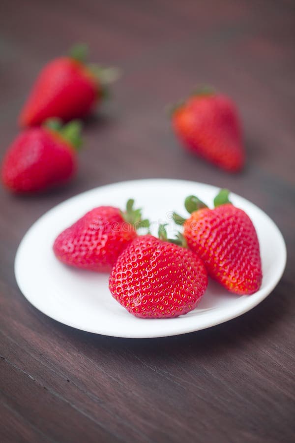 Strawberry in a Plate on a Wooden Surface Stock Image - Image of ...