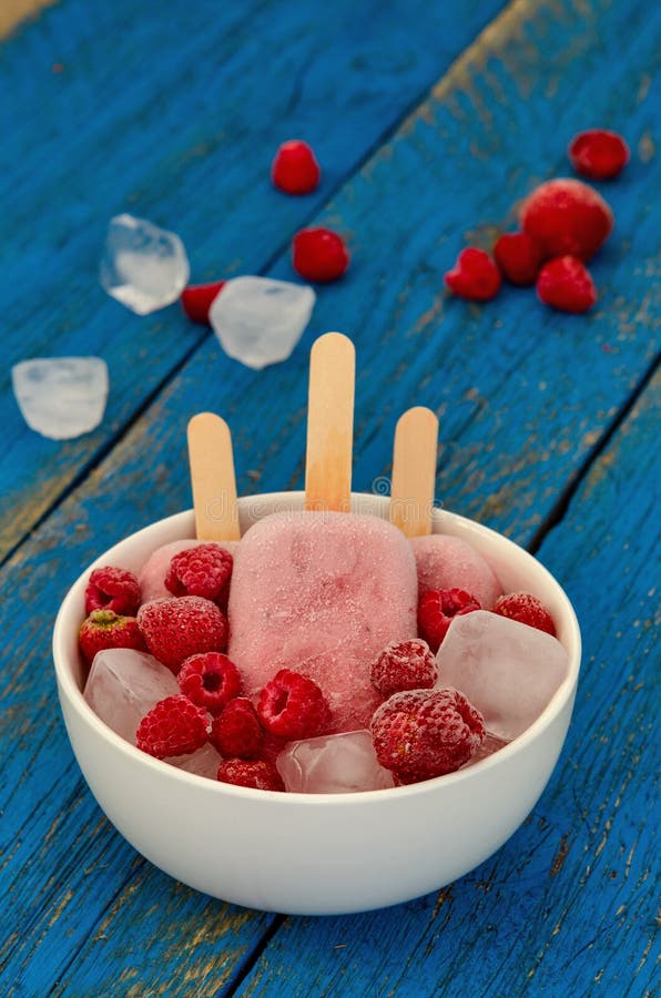 Strawberry and Raspberry Ice Cream Popsicles in White Bowls Stock Image ...