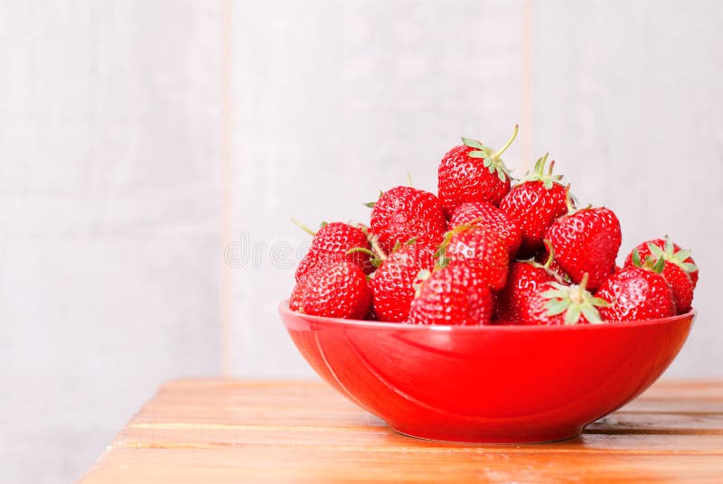 Strawberry Red Plate on the Table, Side View Stock Photo - Image of ...