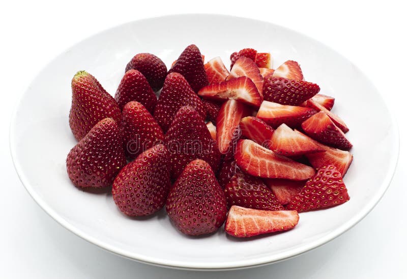 Strawberry and Strawberry Slice on a White Plate Stock Photo - Image of ...