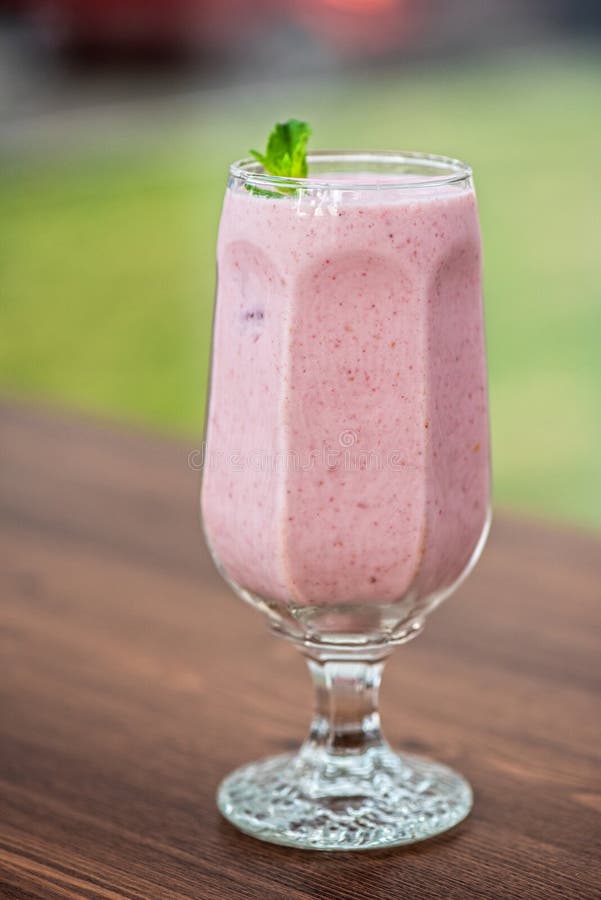 Strawberry Smoothie on Table Stock Photo - Image of glass, juice: 65250320