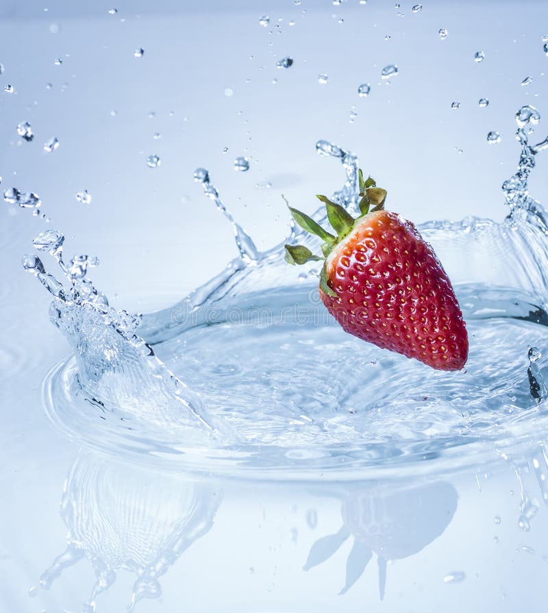 Strawberry Splashing into Water Stock Photo - Image of falling, drop ...