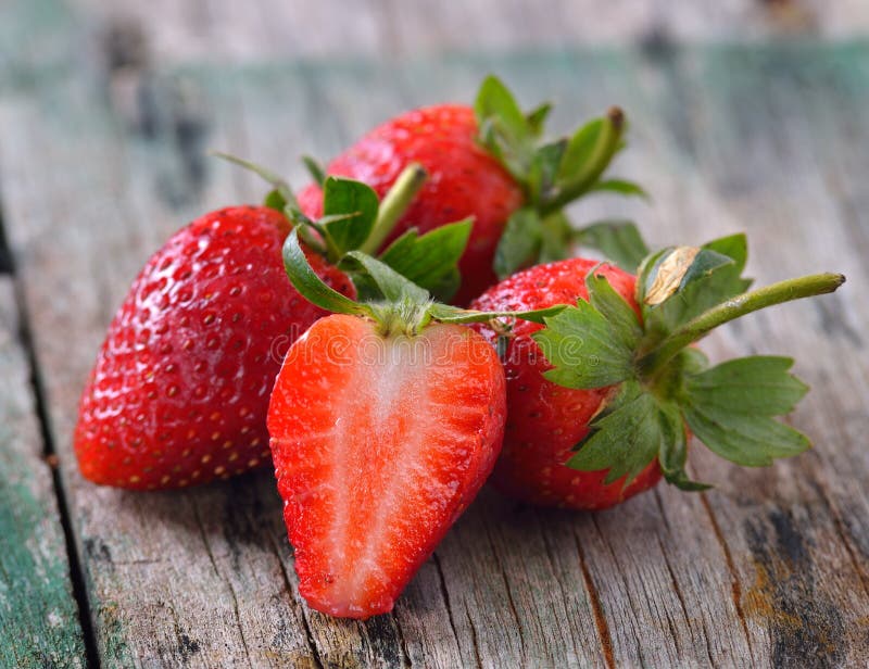 Strawberry on wood table stock photo. Image of closeup - 63662448