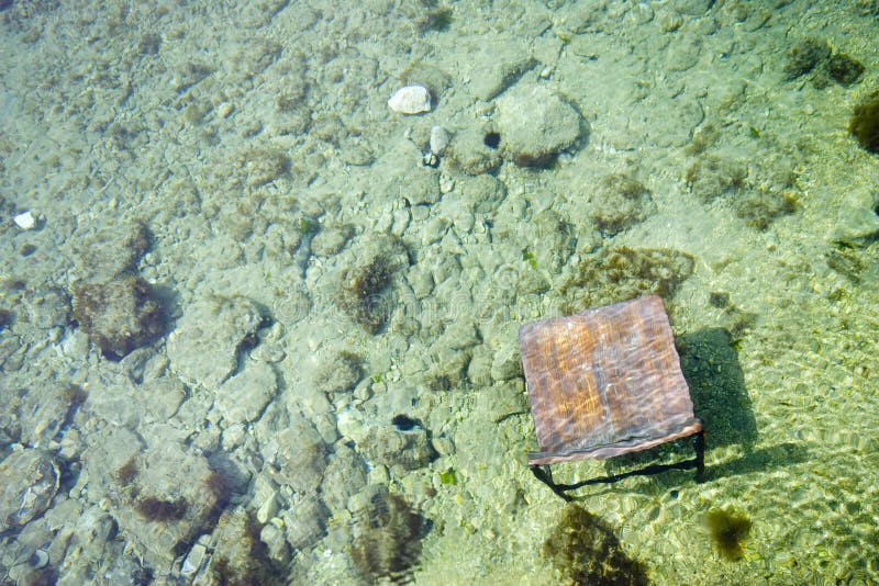 Stray chair under the sea stock photo. Image of adriatic - 144706222