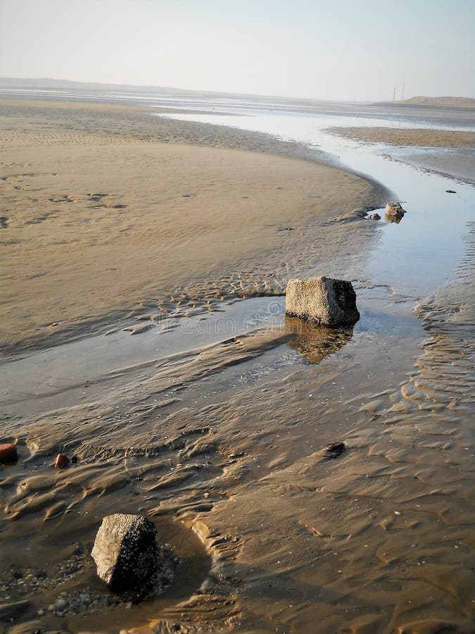 A stream on the beach stock image. Image of backgrounds - 140114393