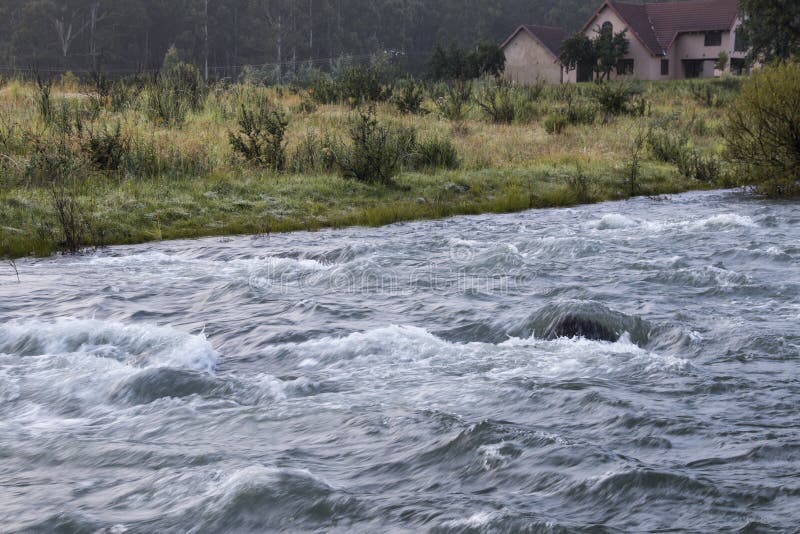 A Fast Stream In Mountainous Terrain. Water Flowing In The River Shown ...