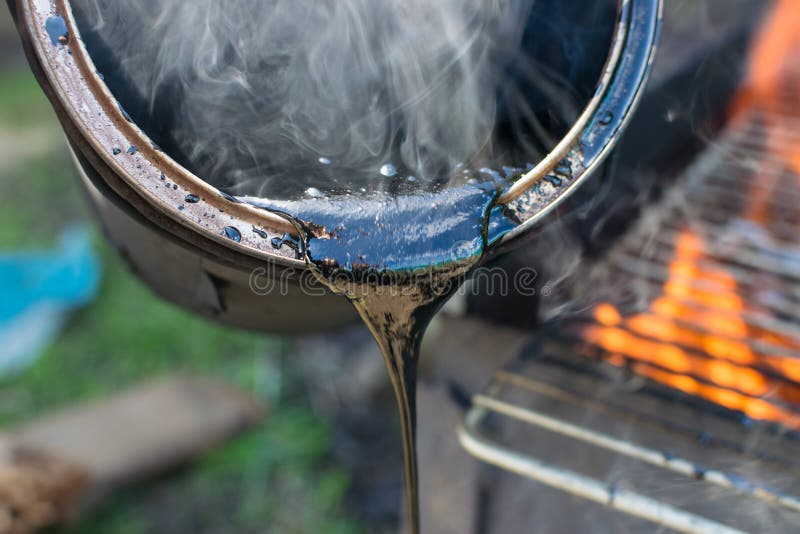 Stream of Black Crude Oil with Steam on Fire for Processing Stock Image ...
