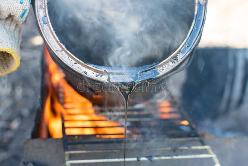 Stream of Black Tar with Steam on Fire for Processing Stock Image ...