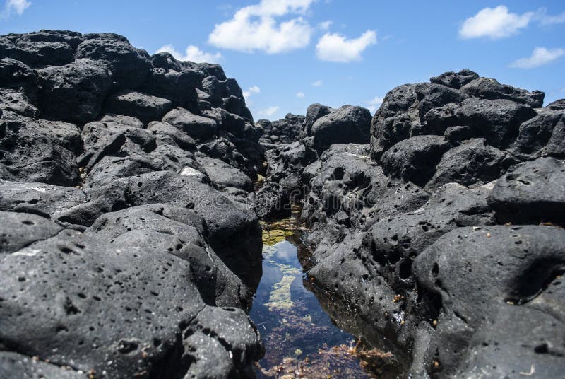Stream in blue basalt stock image. Image of river, clouds - 83284341