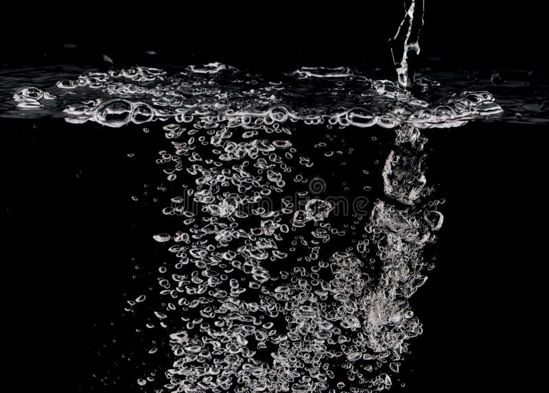 Stream of Bubbles Under Water on a Black Background Stock Image - Image ...