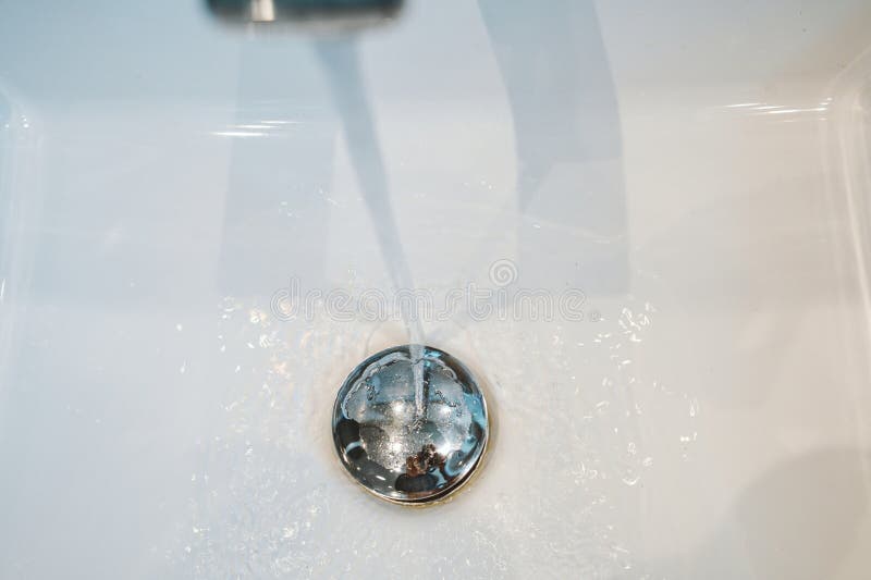 Running Water Flowing into Sink Drain – Clean and Minimalist Concept ...