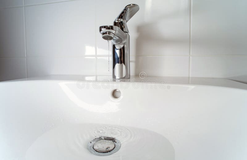 A Stream of Clean Water Flows from the Mixer into the Sink Stock Image ...