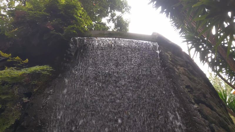 A Stream of Cold Clear Water Flows from a Height. a Small Waterfall ...