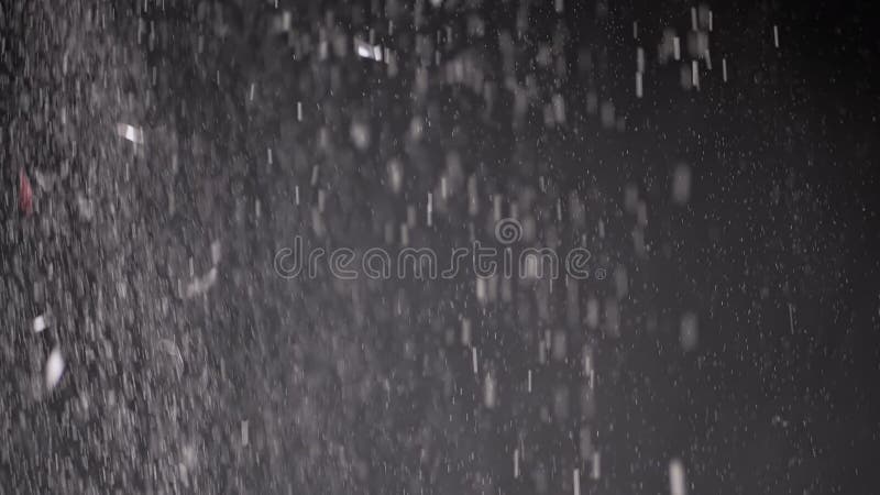 Stream of Falling Confetti, Dust Particles, and Snowfall on Black ...
