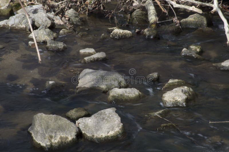 Stream Flowing through Group of Rocks Stock Photo - Image of shallow ...