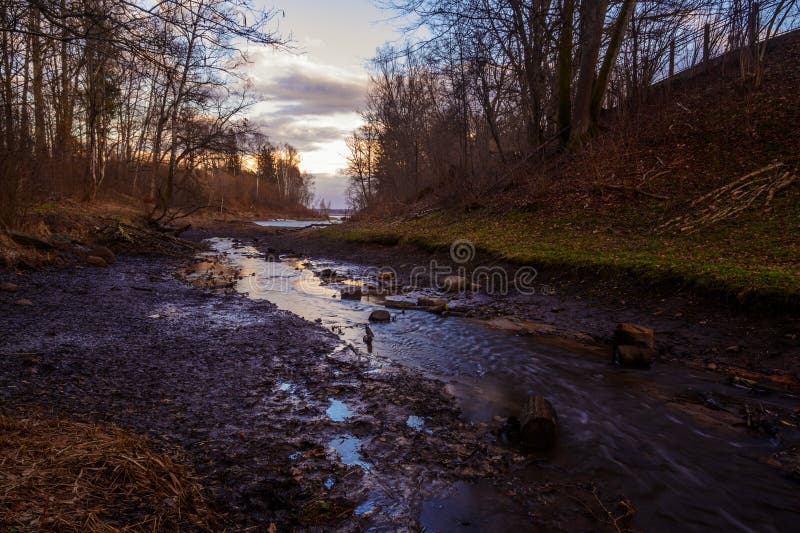 A Stream Flowing into a Large River in Aizkraukle 1 Stock Image - Image ...