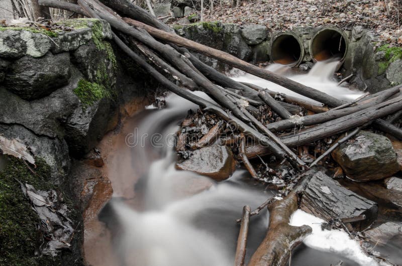 Stream Flowing between Rocks and Branches Stock Image - Image of ...