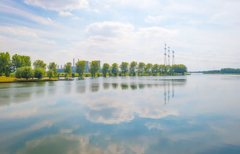 Stream Flowing through a Tree Lined Field in Sunlight Stock Image ...