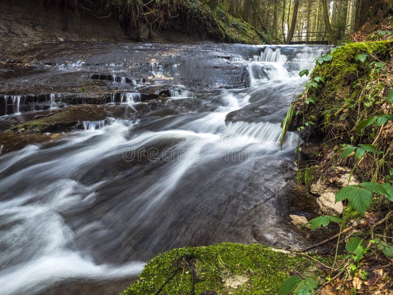 Stream with flowing water stock image. Image of alpine - 69645661