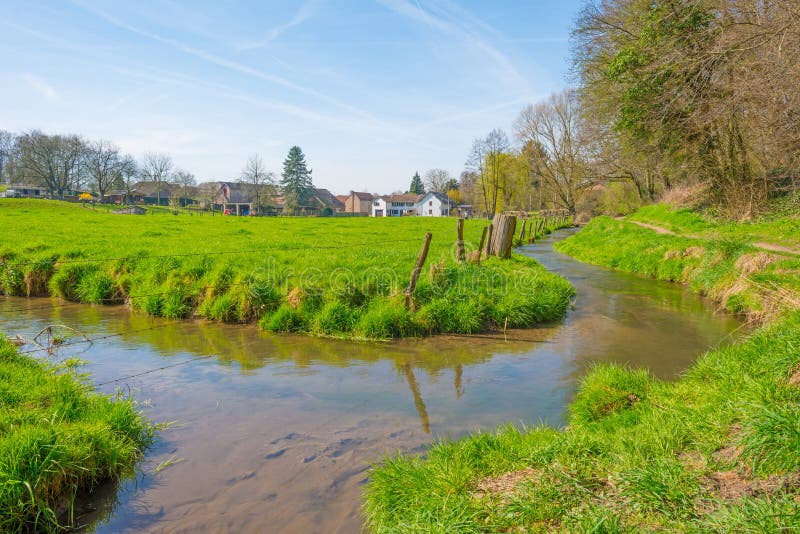 Stream Flows through a Meadow in Spring Stock Photo - Image of track ...