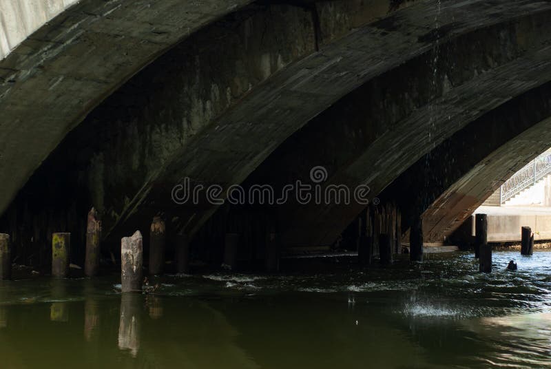 The Stream Flows Under the Old Bridge Stock Photo - Image of arched ...