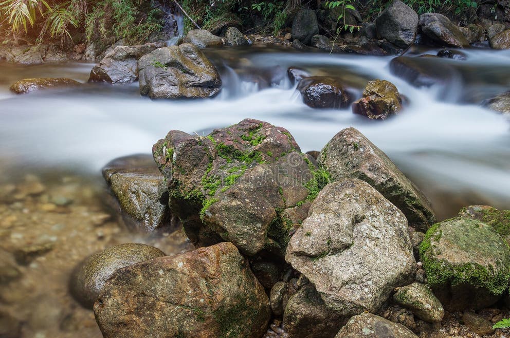 The Stream Flows from the Waterfall. it is a Water Route through the ...