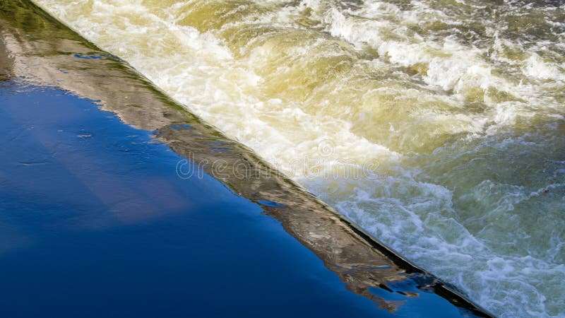 A Stream of Foaming Water and a Small Ledge on the River Stock Photo ...