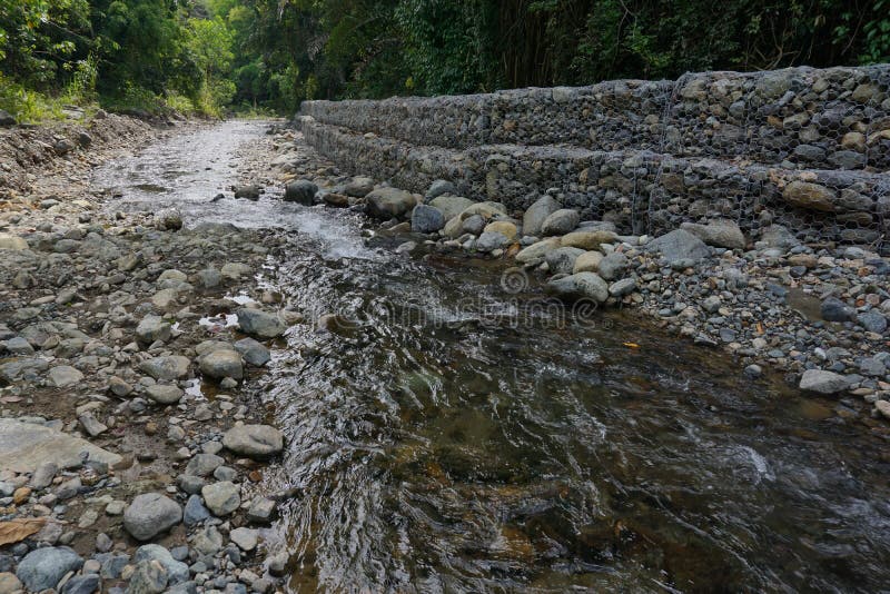 Stream with gabion wall stock image. Image of development - 78240873