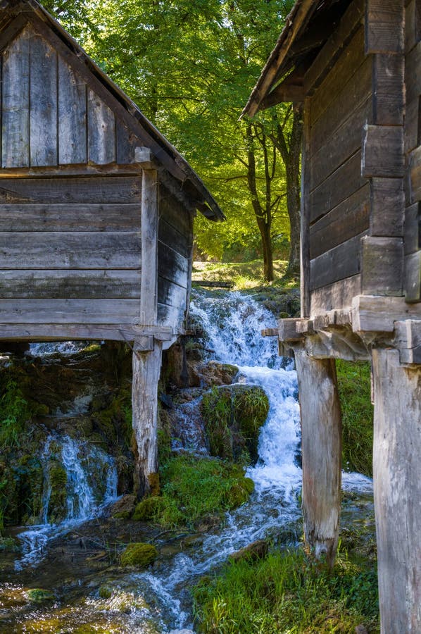 Stream and huts stock photo. Image of scenics, building - 326160014