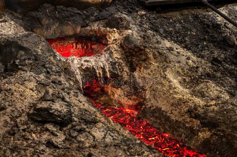 A Stream of Liquid Metal Flowing in a Sandy Channel Stock Image - Image ...