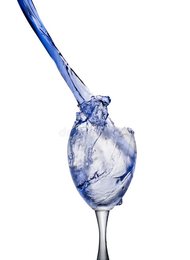 A Stream of Poured Bright Blue Liquid Splashes into a Clear Wine Glass ...