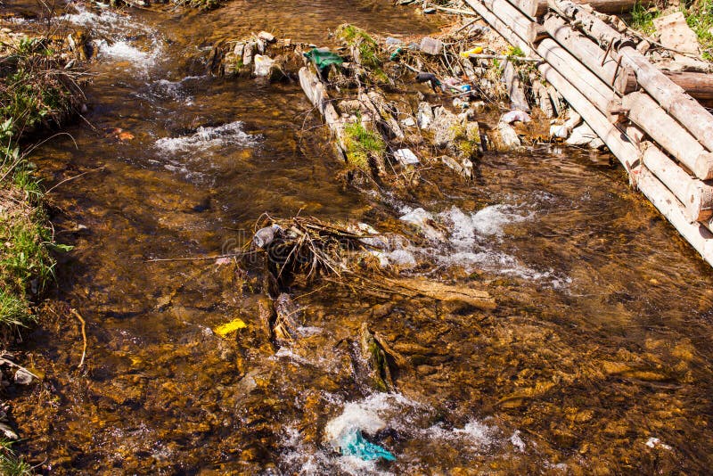 Stream with Running Water, Polluted by Plastic Garbage Stock Image ...