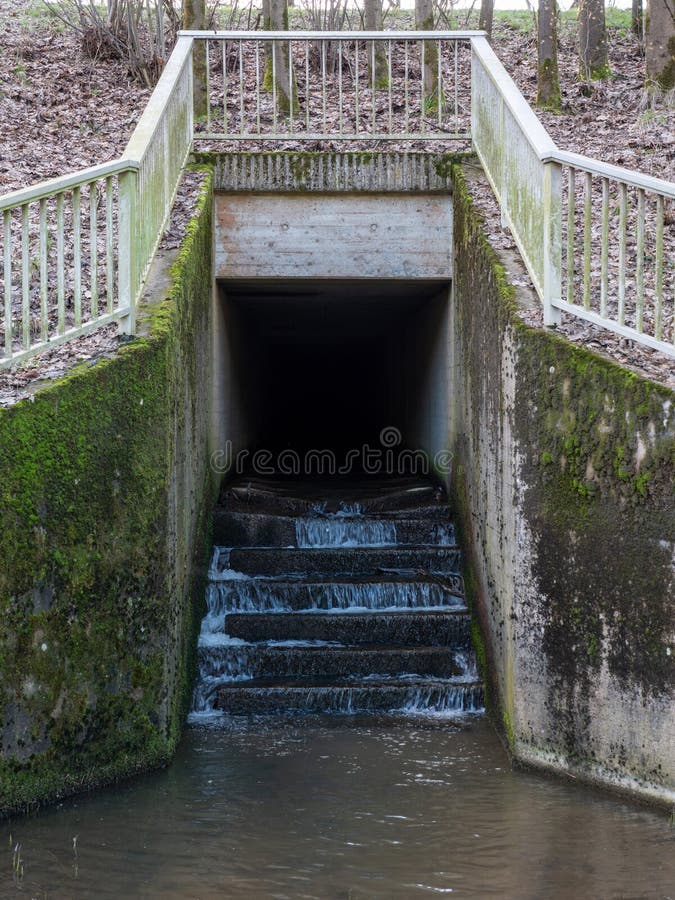 Stream that is Tunneled Under and Flows Out Over Steps Stock Photo ...