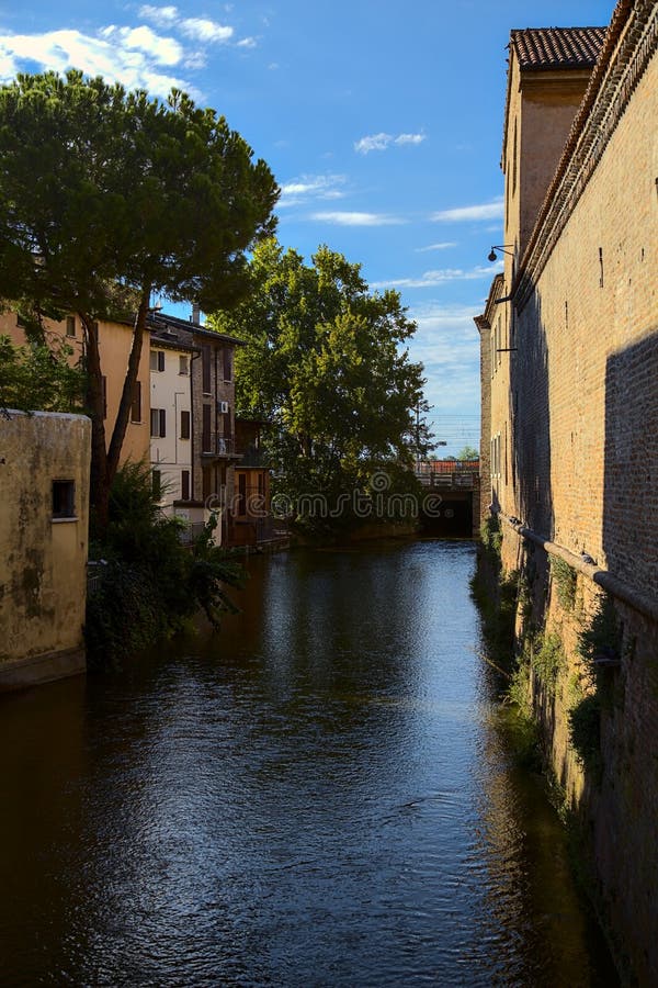 Stream of Water Bordered by Tall Buildings with Trees in a European ...