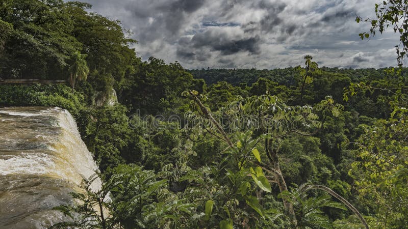 A Stream of Water Falls from the Edge of the Ledge Stock Photo - Image ...