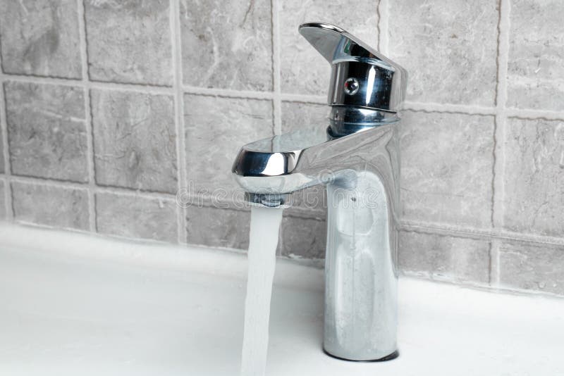 Stream of Water from Faucet To Sink in the Bathroom Stock Photo - Image ...