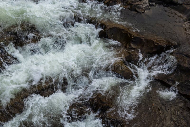 The Stream of Water Flowing Over Rocks.Image Close-up Stock Image ...