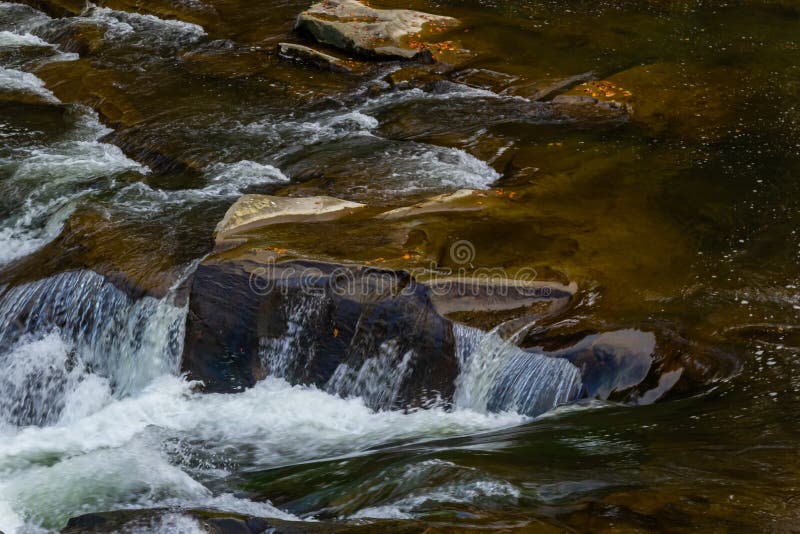 The Stream of Water Flowing Over Rocks.Image Close-up Stock Photo ...