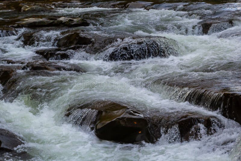 The Stream of Water Flowing Over Rocks.Image Close-up Stock Photo ...